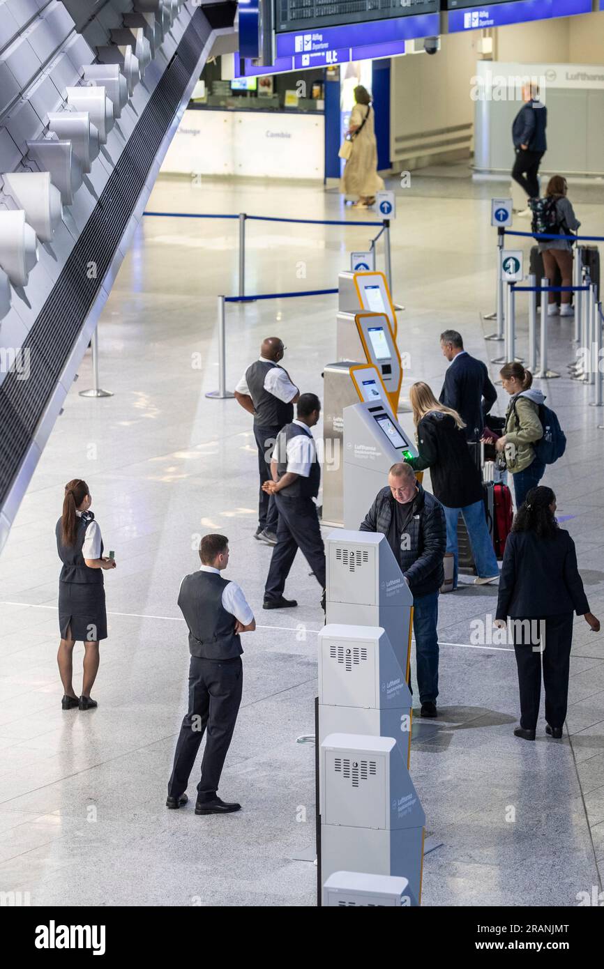 05 July 2023, Hesse, Frankfurt/Main: Travelers operate airline self ...