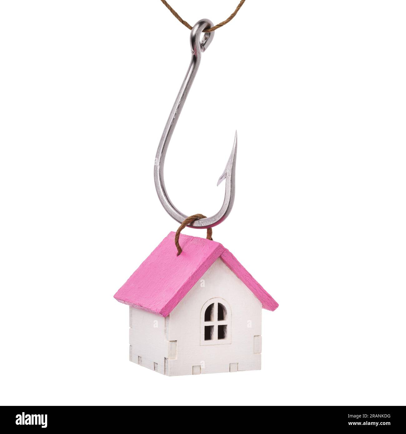 Toy house on a hook isolated on a white background, a concept on the ...