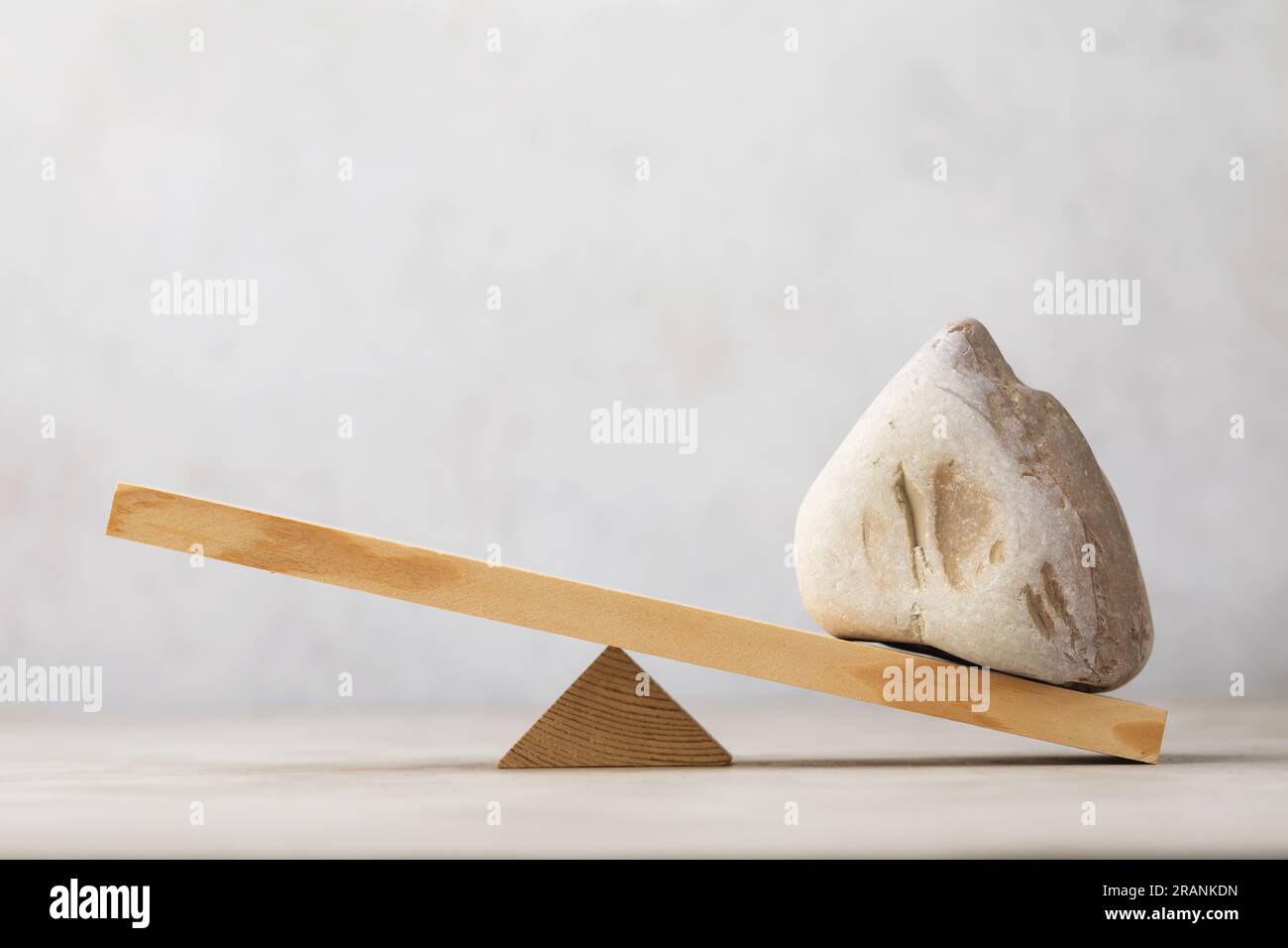 Stone on wooden swing or scales on abstract background, template for ...