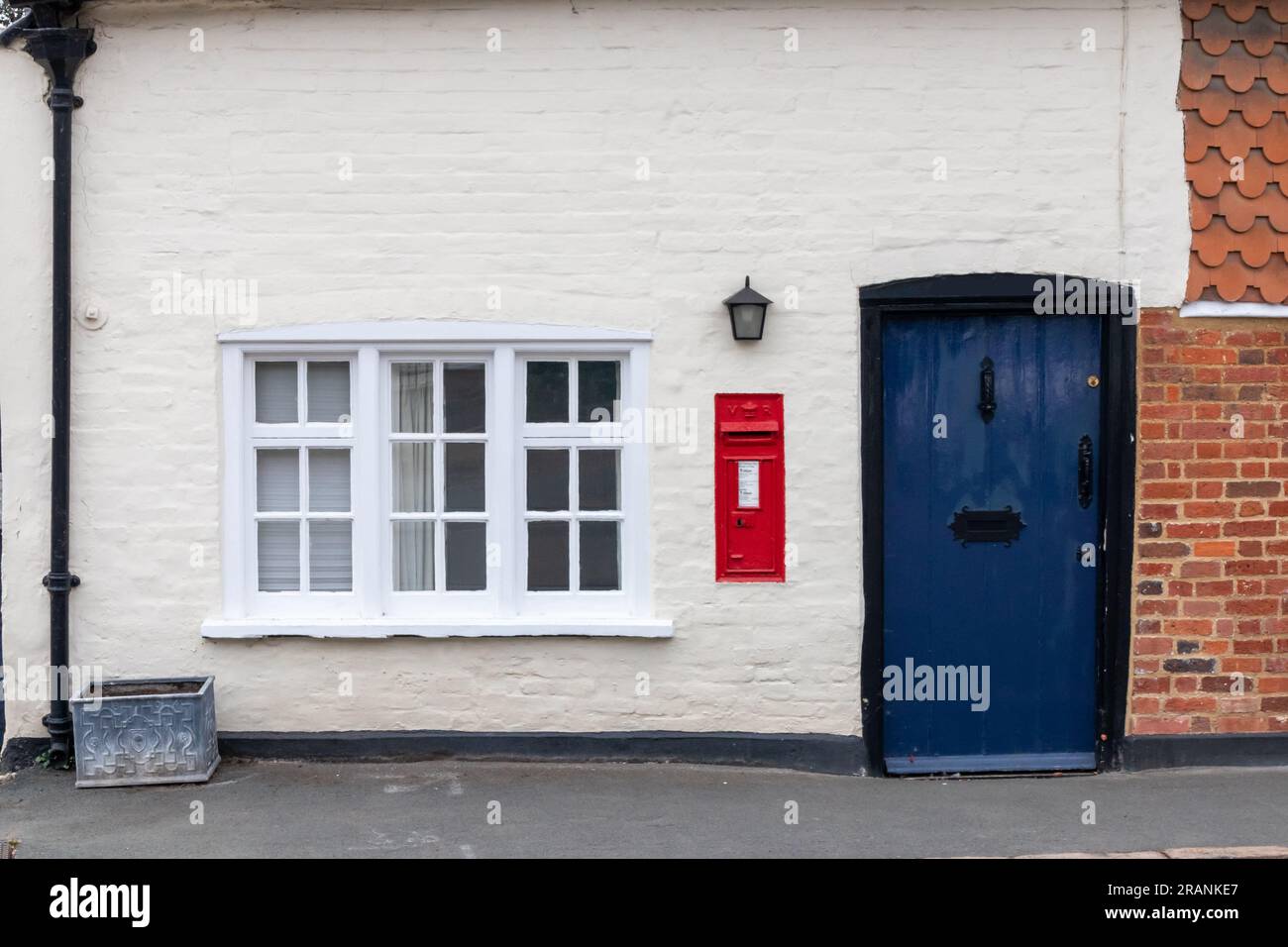 English country cottage with postbox embedded in the wall, Great ...