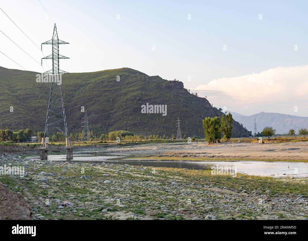 Flooded power line tower in the river Stock Photo - Alamy