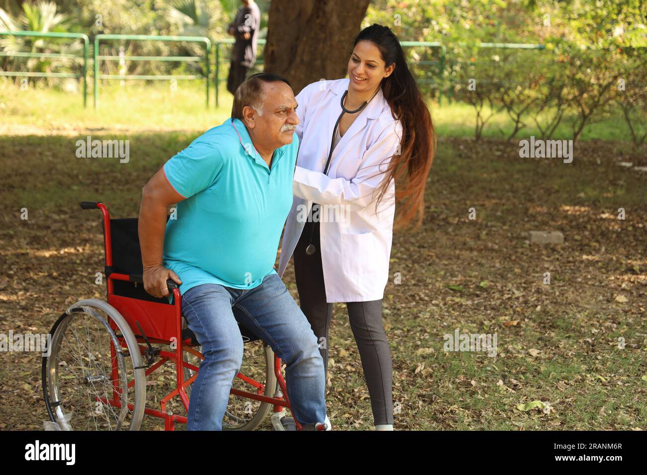 Accidental patient trying to stand up. Female doctor helping old aged ...