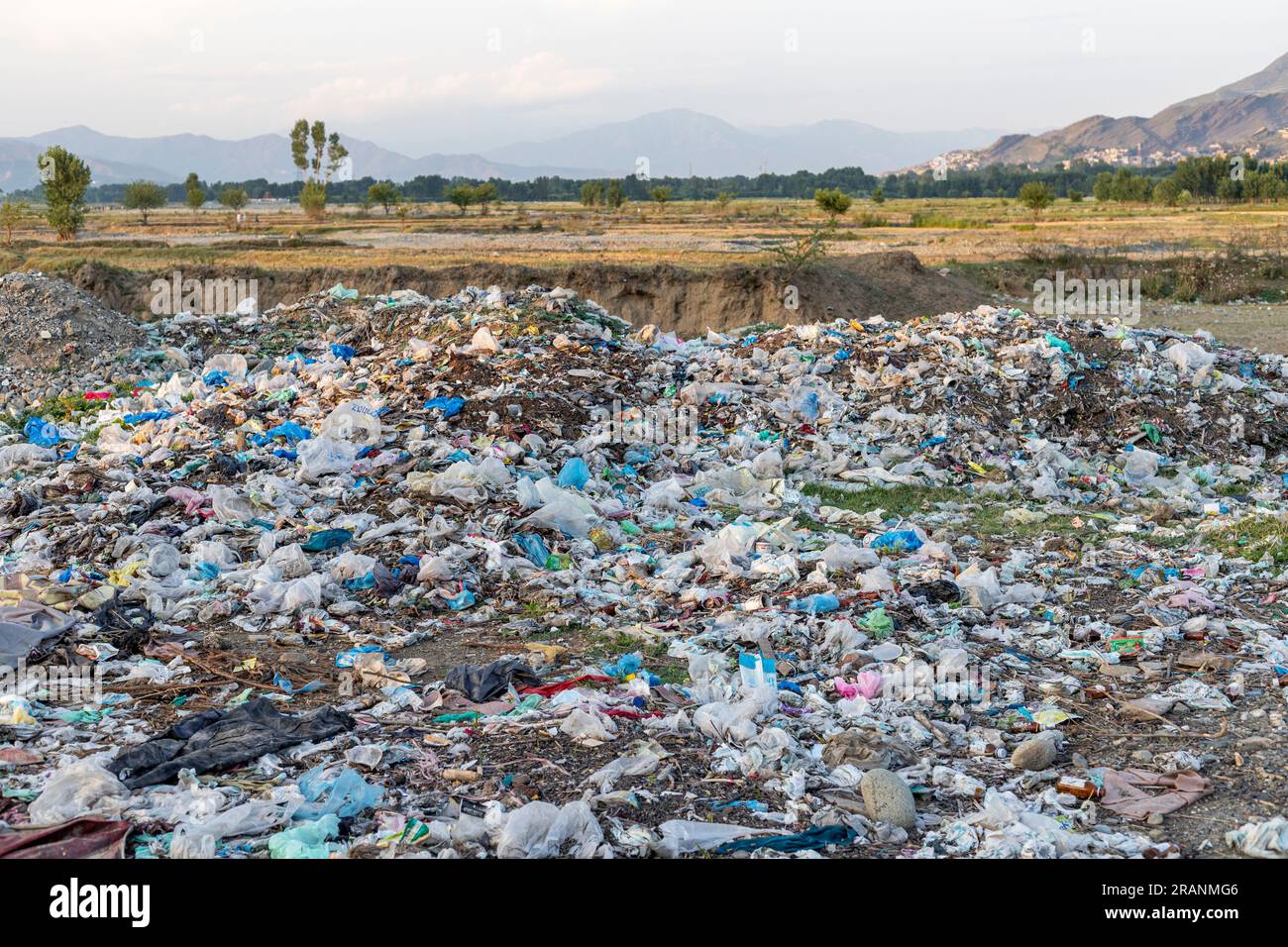 Garbage pile or trash landfill in the agricultural fields. Environment ...