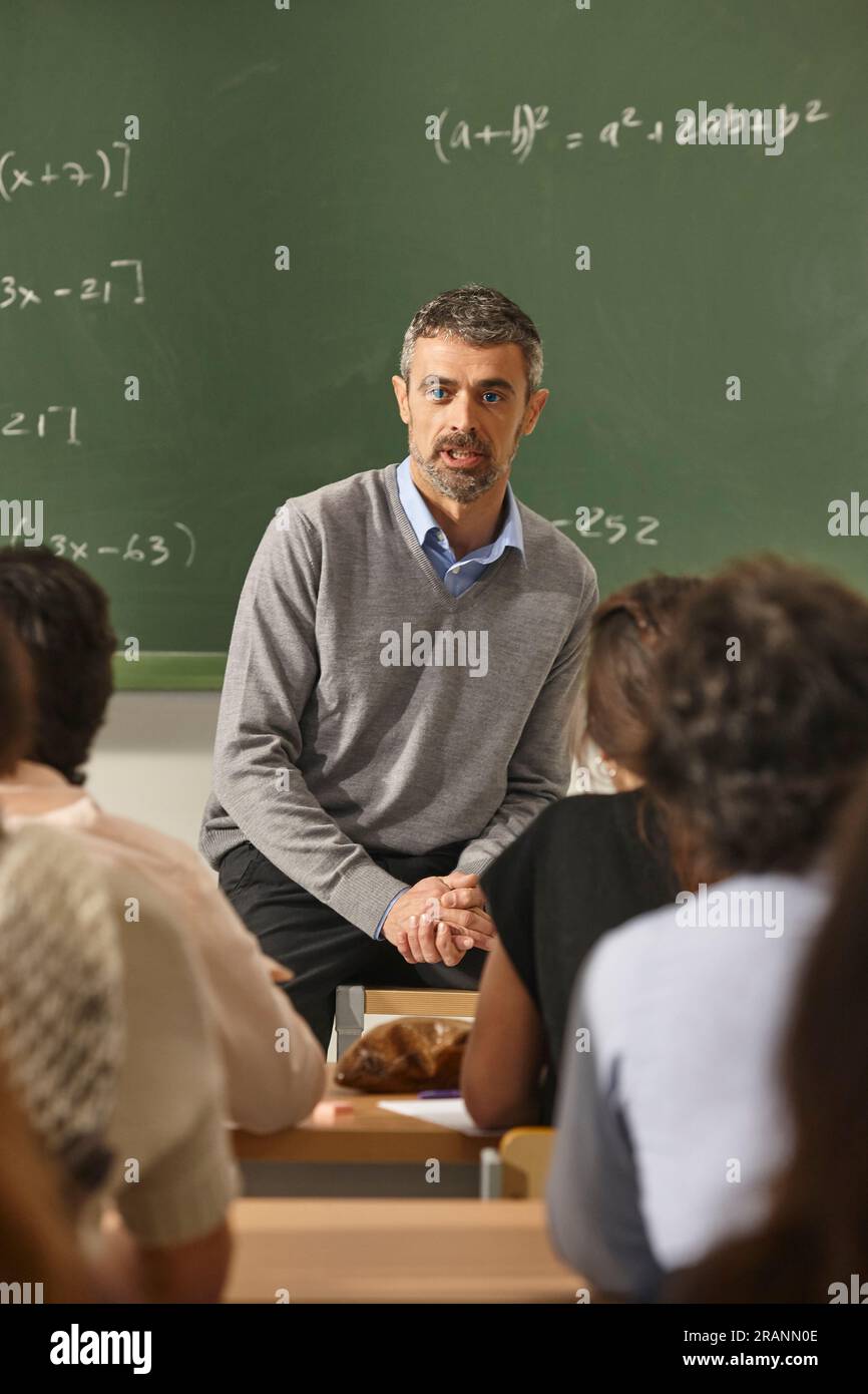 Math teacher giving lessons. Classroom with students. School education ...