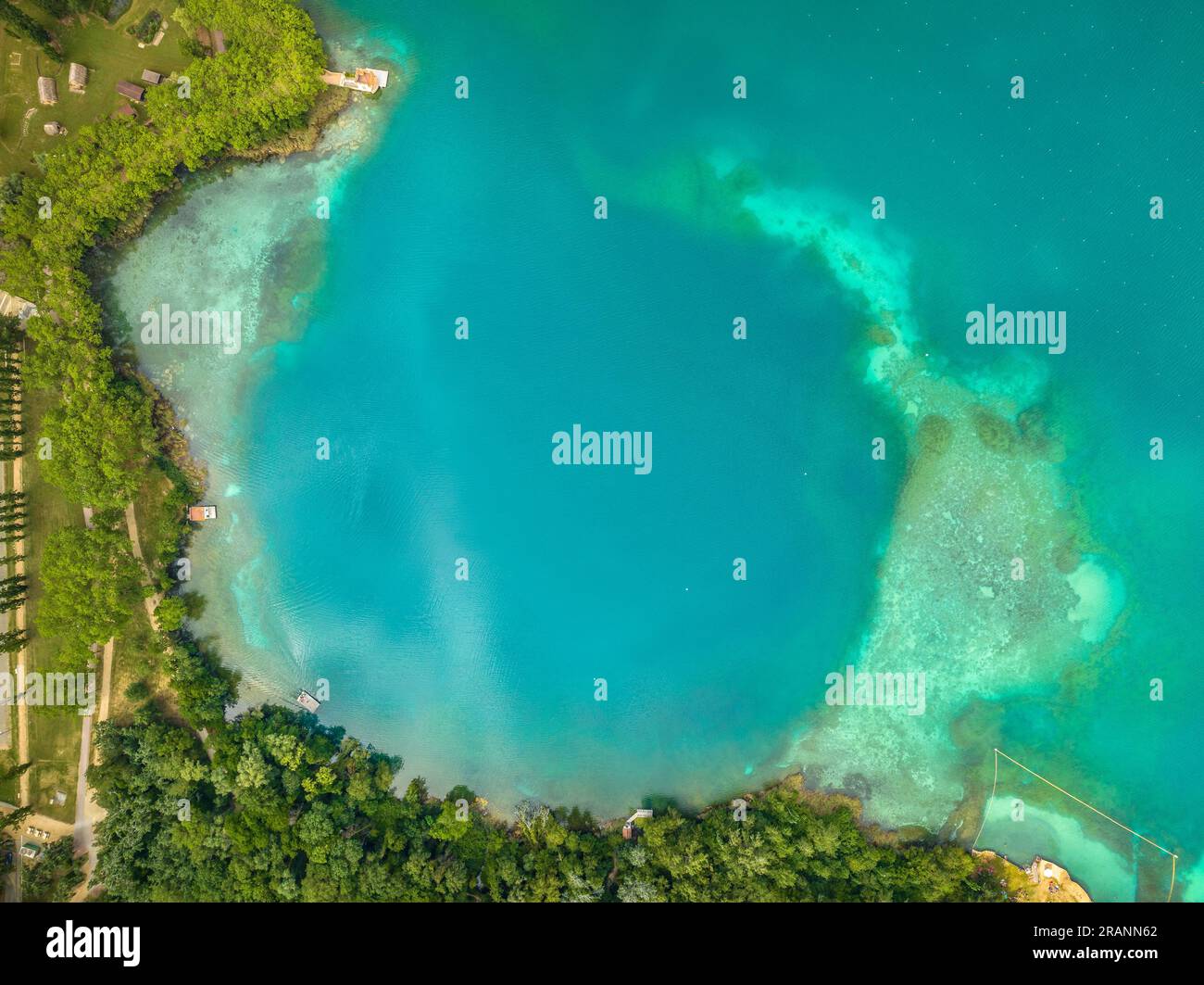 Aerial zenithal view of the Estany de Banyoles lake, the riverside ...