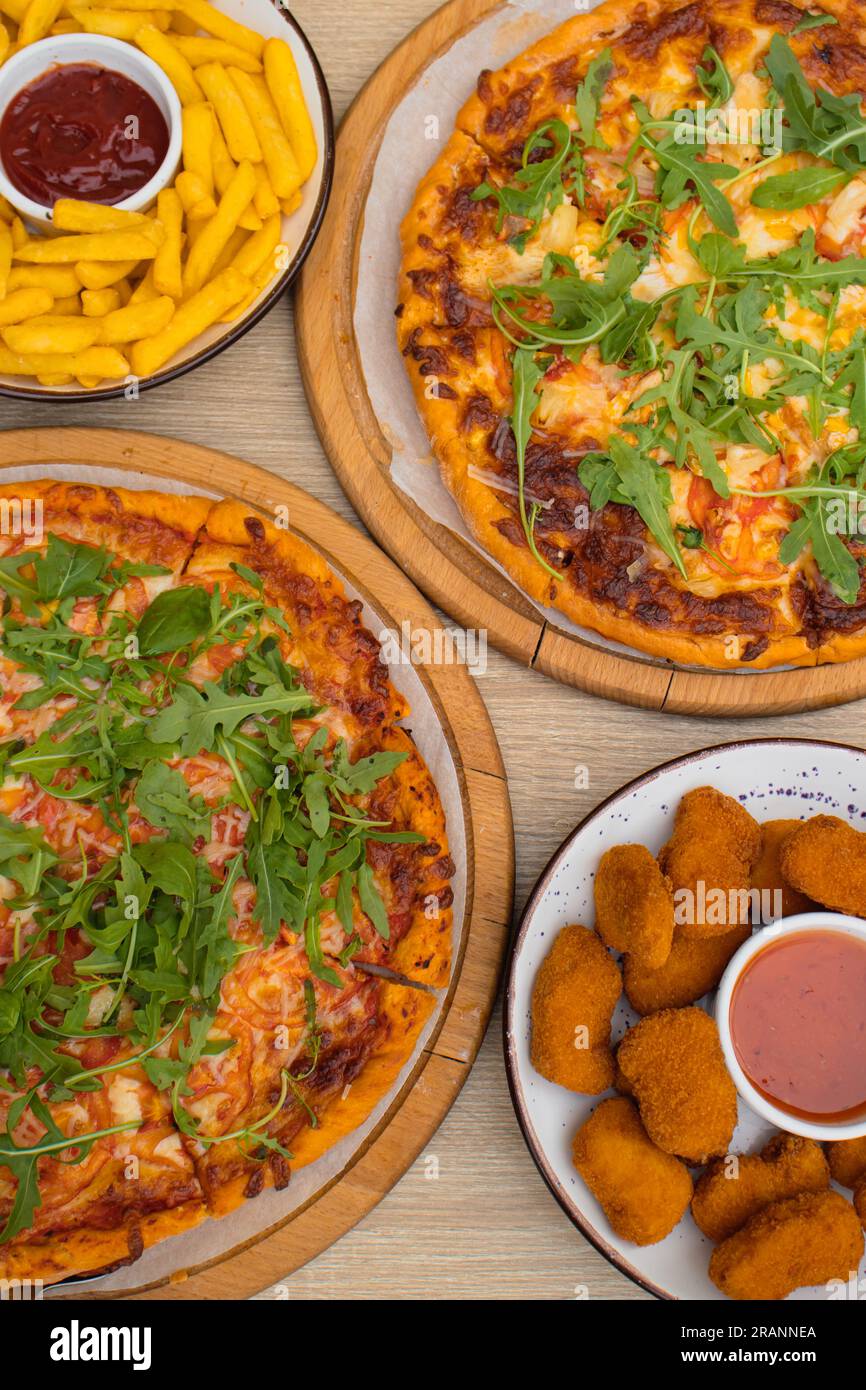 Two pan pizzas in two pizza boxes with their two different flavors ...