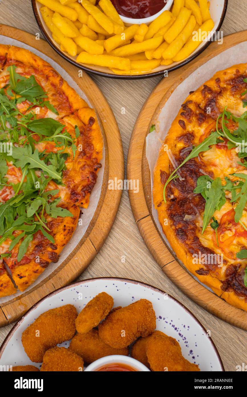 Two pan pizzas in two pizza boxes with their two different flavors ...