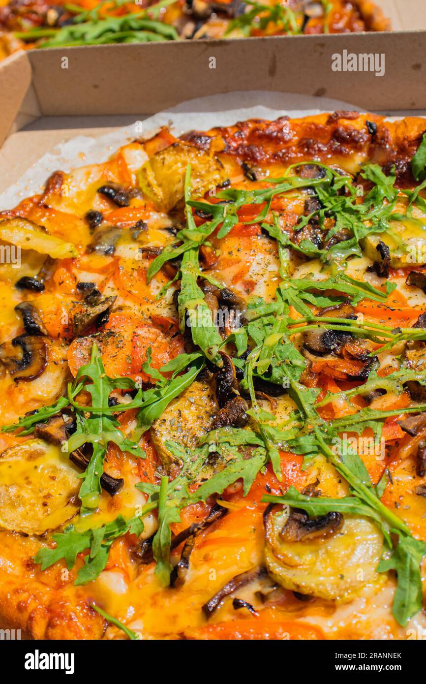 Two pan pizzas in two pizza boxes with their two different flavors ...