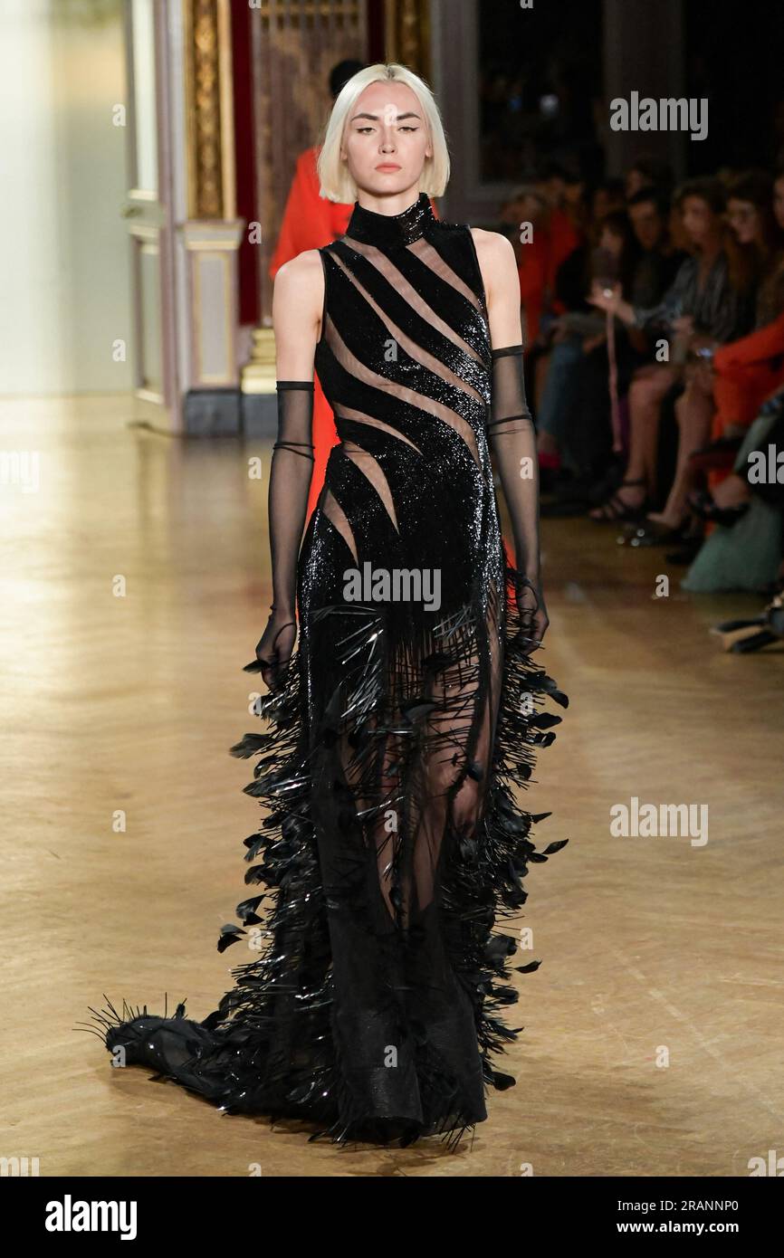 Paris, France. 04th July, 2023. A model walks the runway at the Georges ...