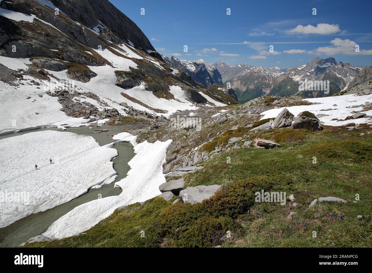 The lac des Vaches (Vaches lake) covered with snow, located above ...