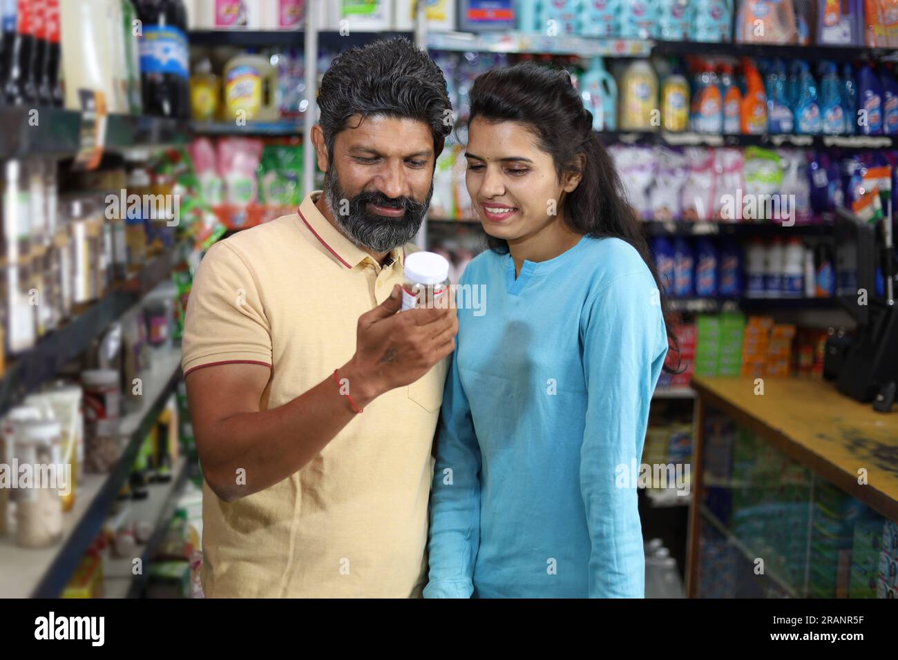 Indian young couple shopping in supermarket hi-res stock photography ...
