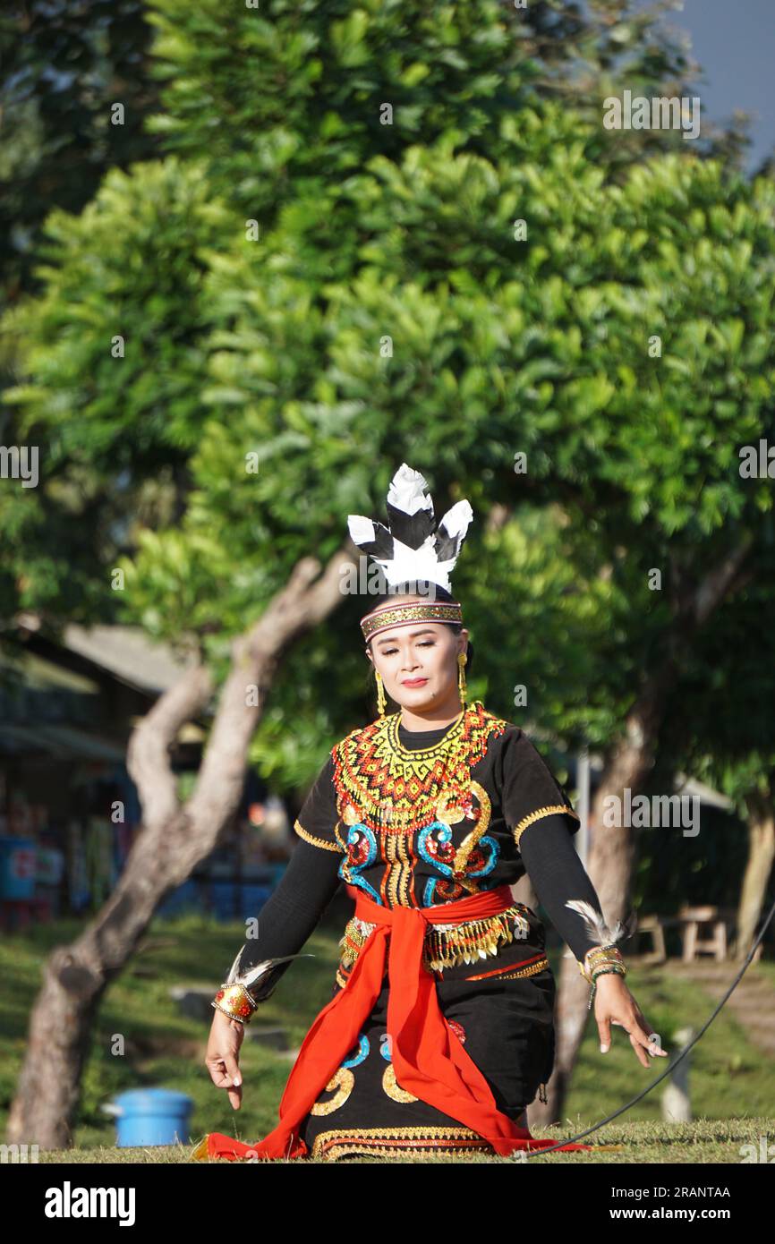 Indonesian performing burung nuri (parrot) dance. This dance comes from ...