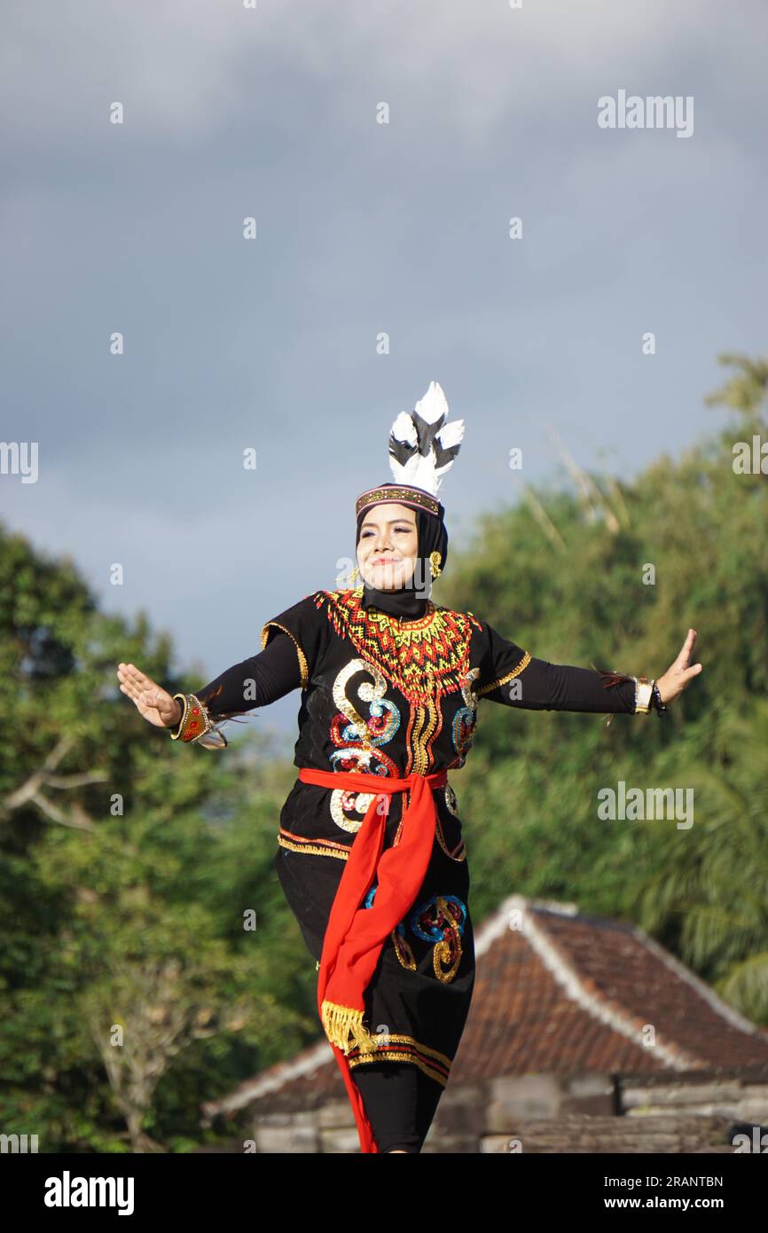 Indonesian performing burung nuri (parrot) dance. This dance comes from ...