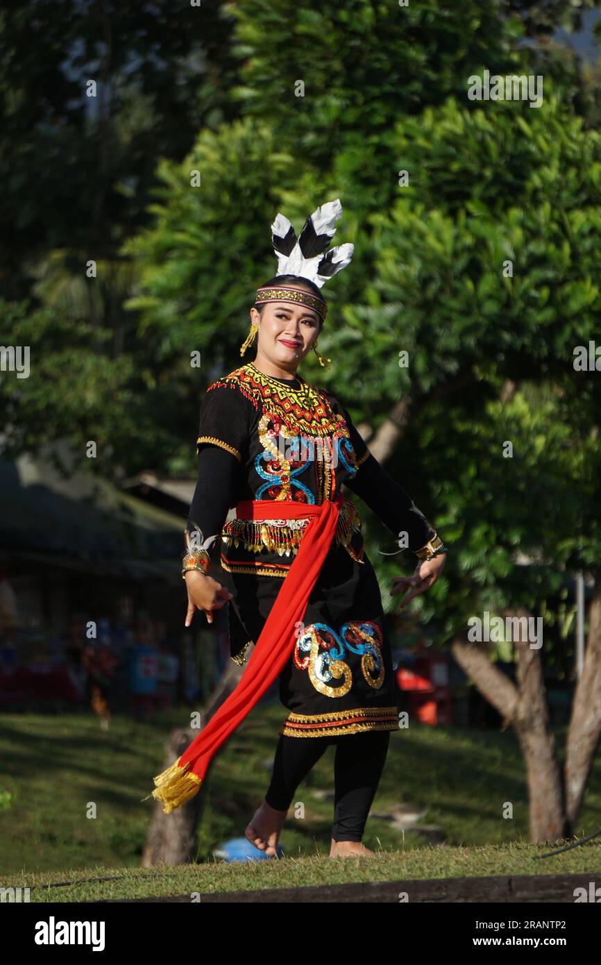 Indonesian performing burung nuri (parrot) dance. This dance comes from ...