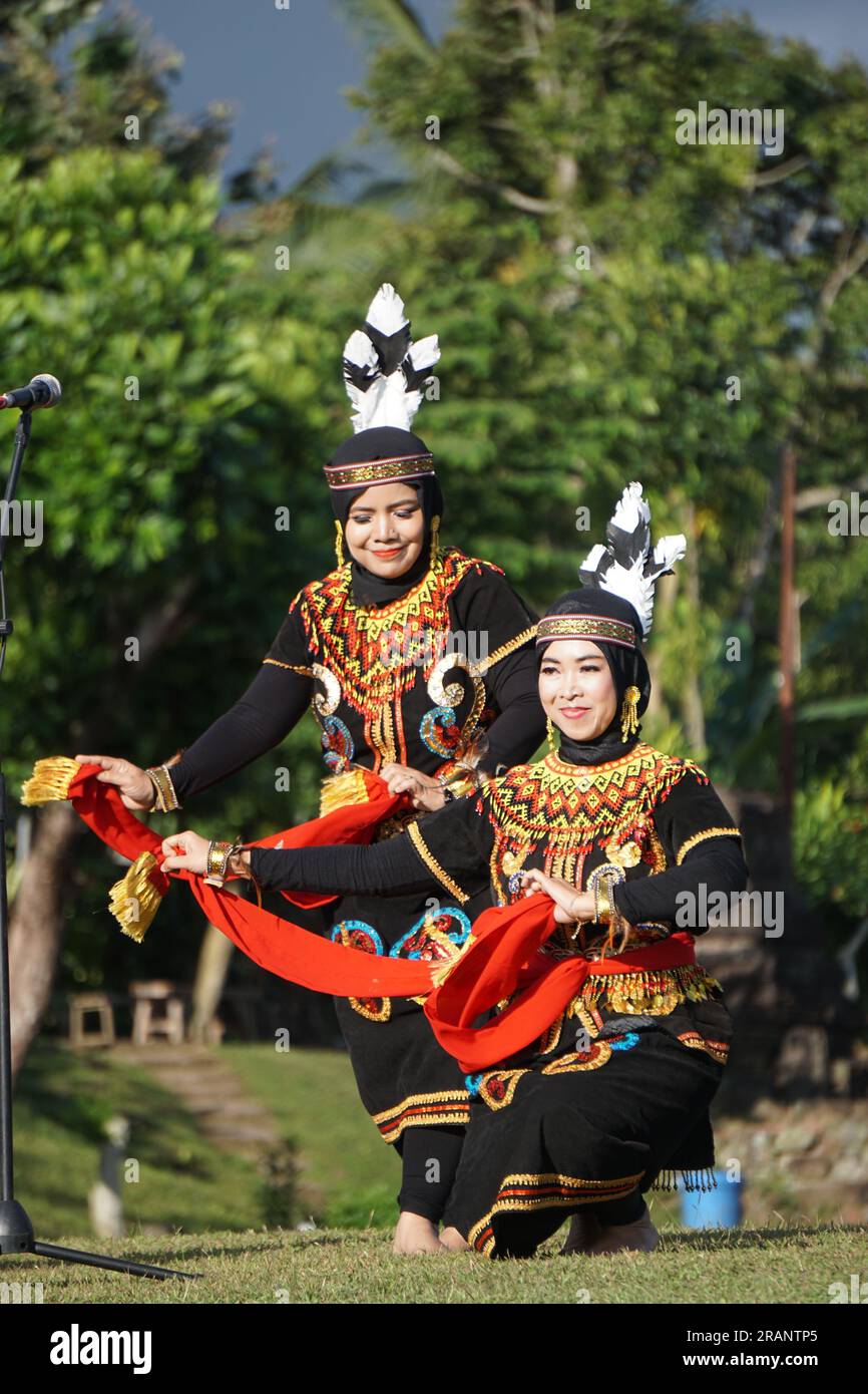 Indonesian performing burung nuri (parrot) dance. This dance comes from ...