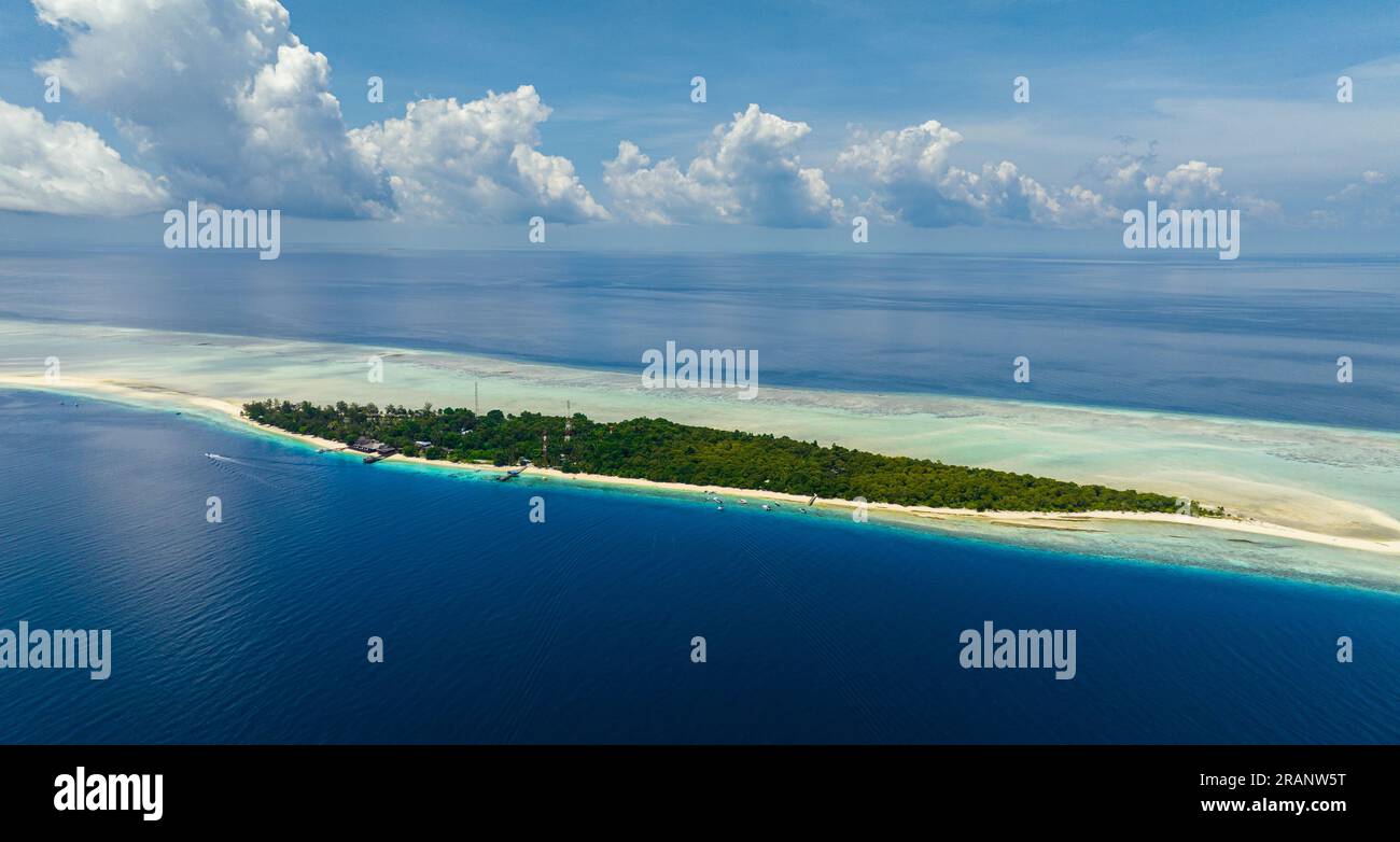 Aerial view of Mataking island on a coral reef or atoll with a sandy ...