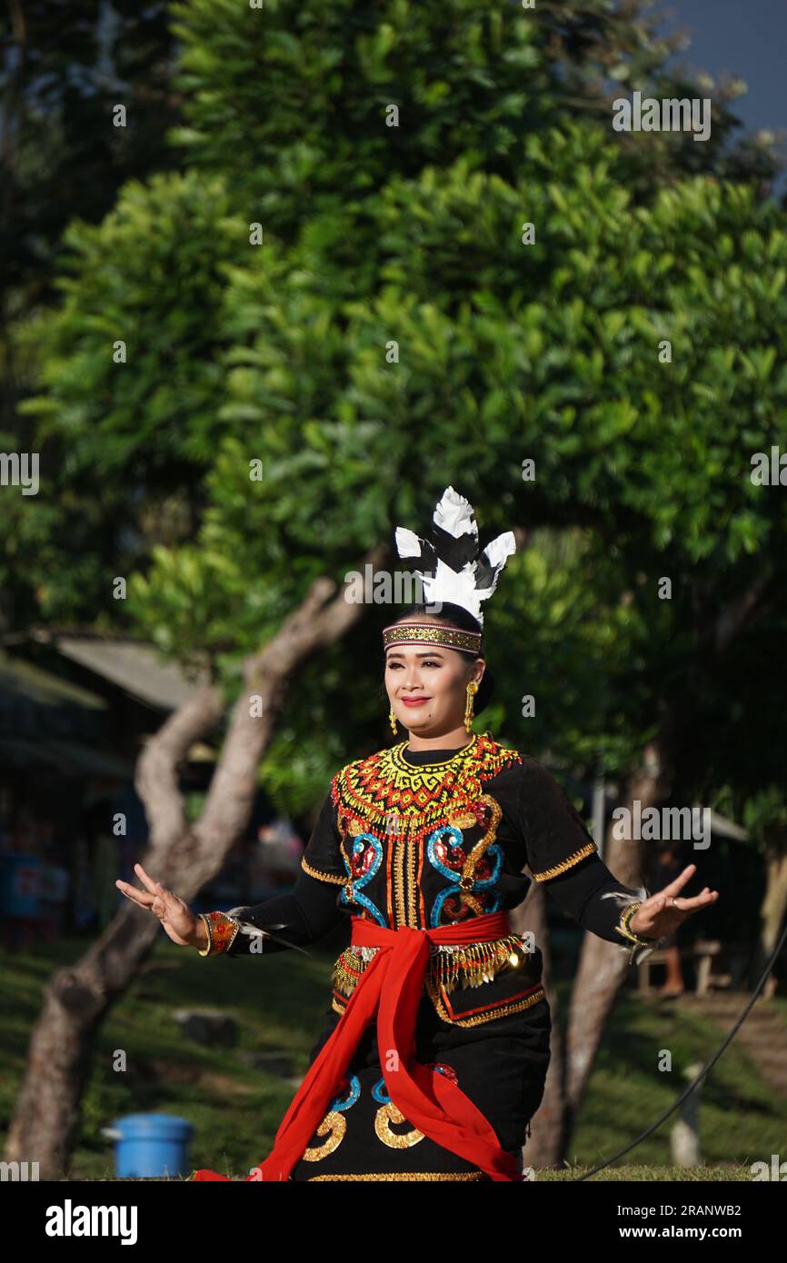 Indonesian performing burung nuri (parrot) dance. This dance comes from ...