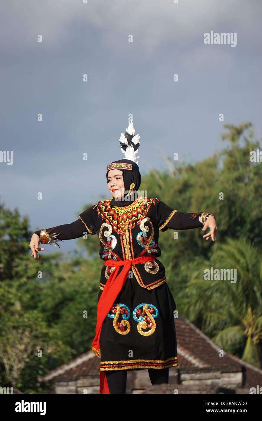 Indonesian performing burung nuri (parrot) dance. This dance comes from ...