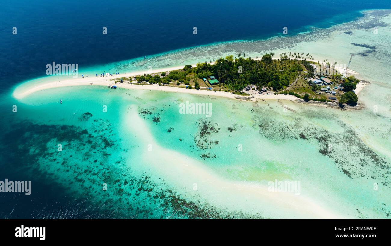 A beautiful Sibuan island with a beach and a coral atoll. Tun Sakaran ...