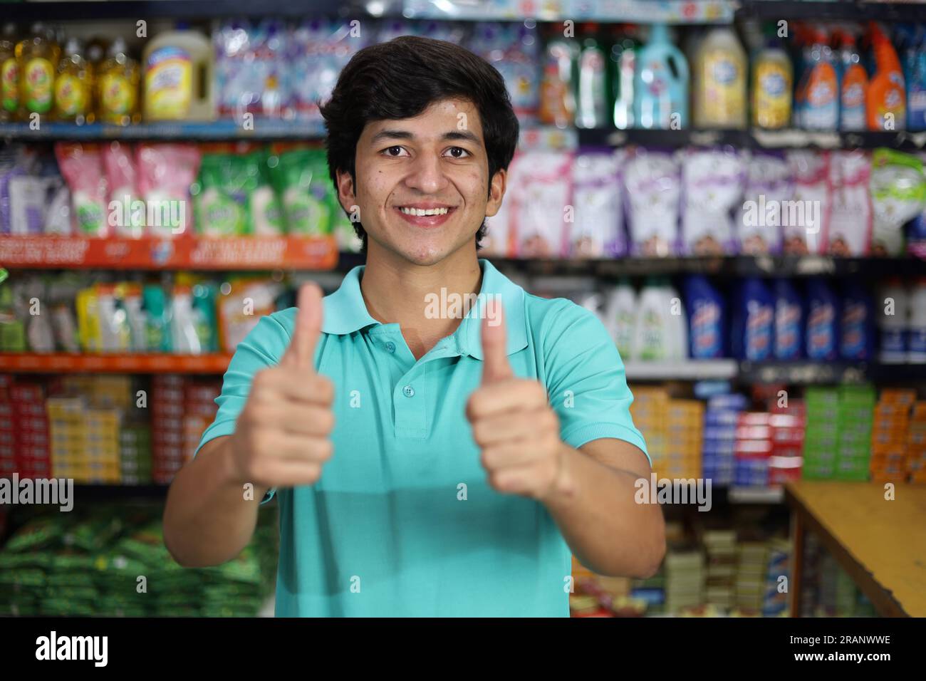 Portrait of Happy and smiling fit boy purchasing in a grocery store ...
