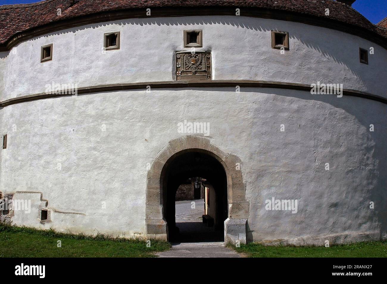 A semi-circular bastion, pitted with square embrasures, in medieval ...
