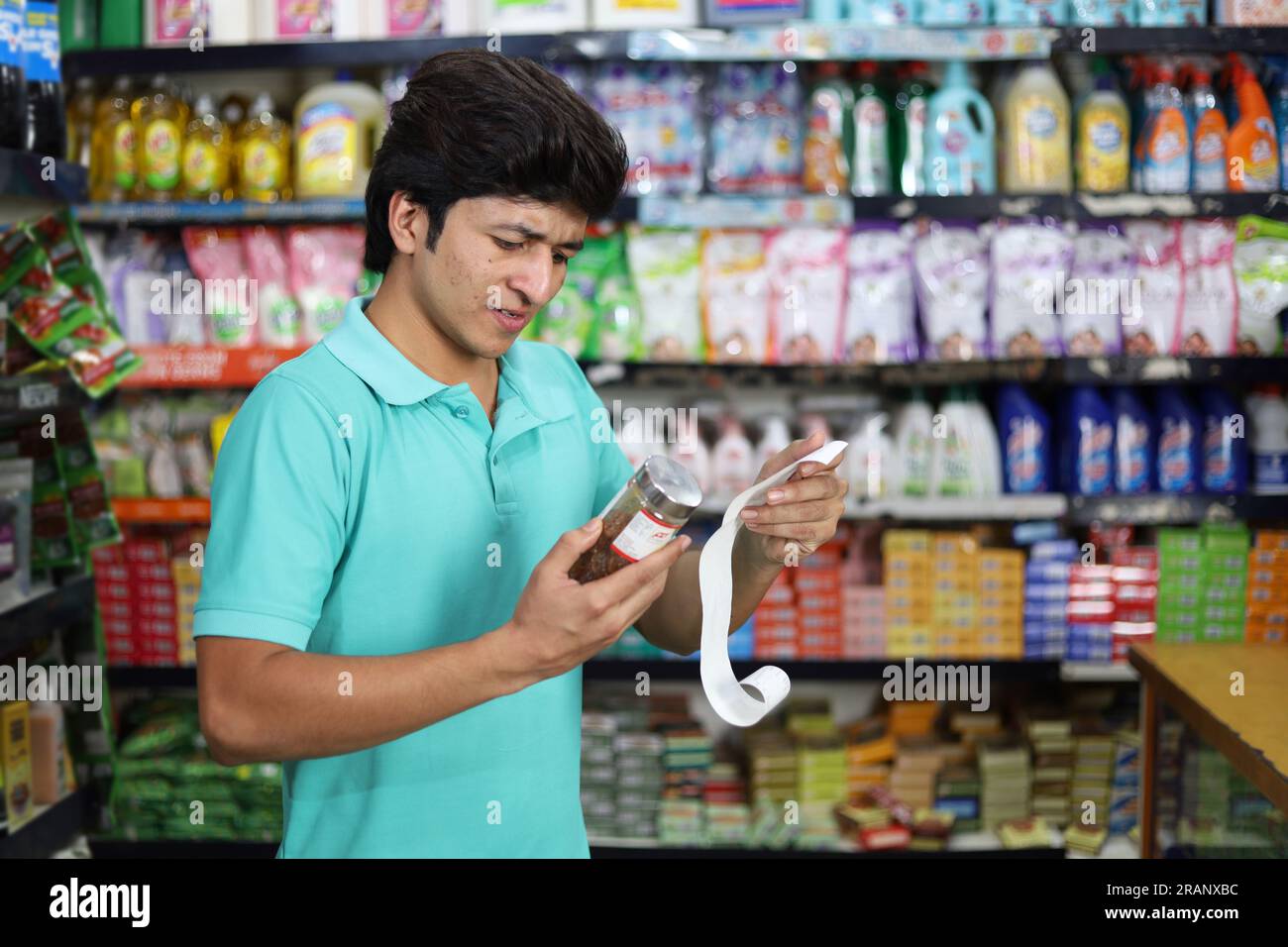 Boy standing in front of the product counter in a grocery store. Boy ...