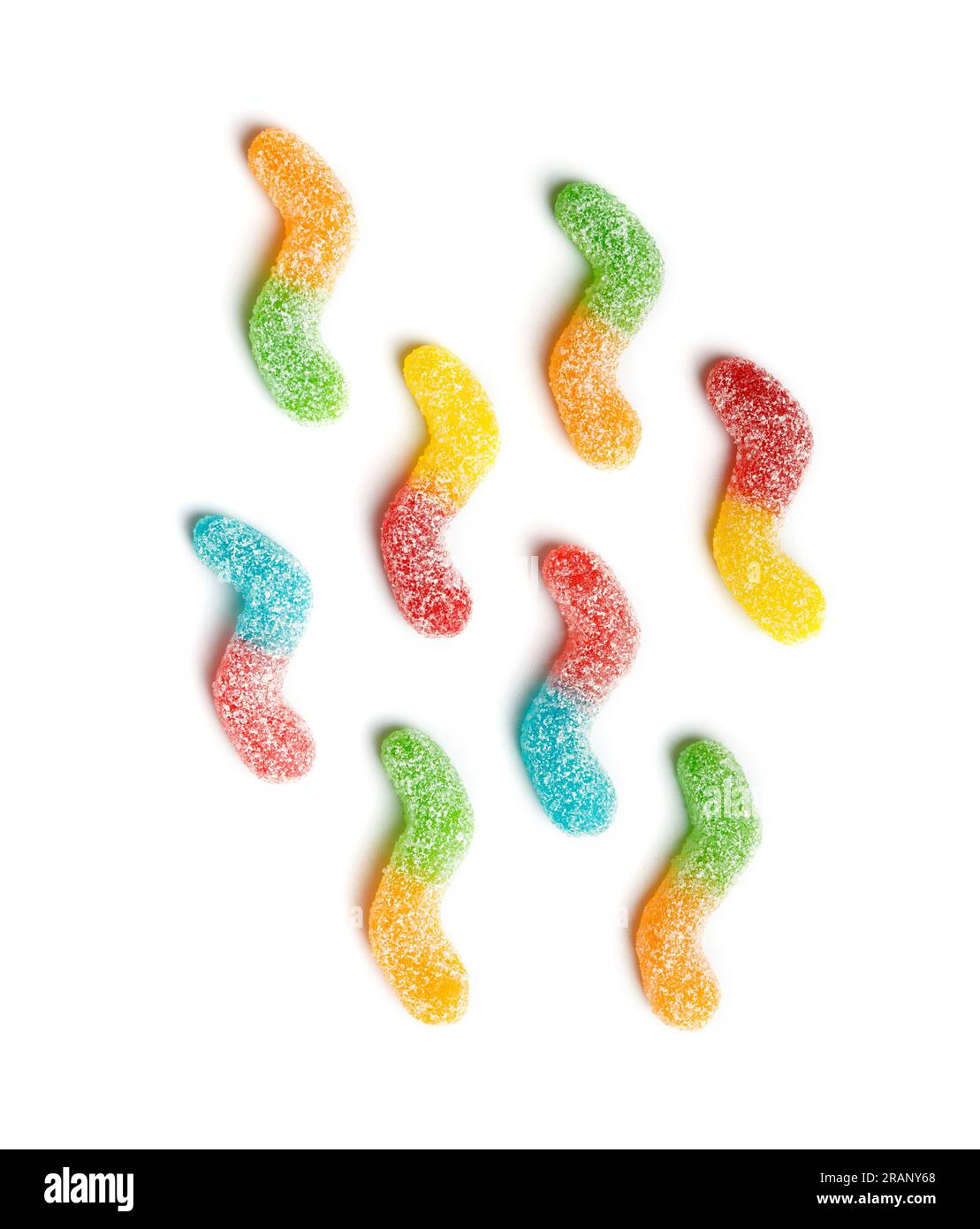 Multicolored gummies in sugar on a white background, top view. Jelly ...