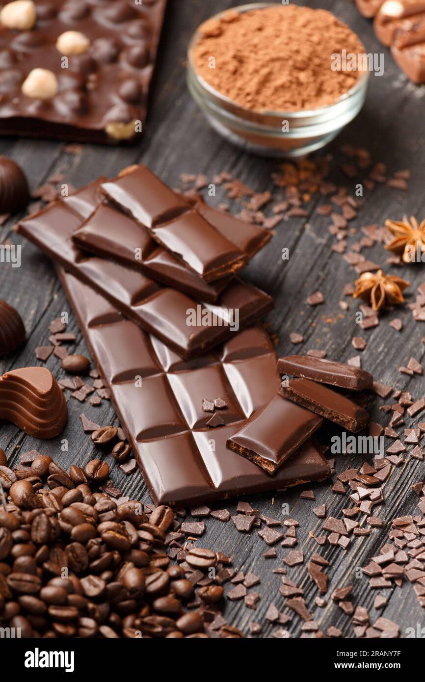 Chocolate, cocoa powder, chocolate chips, cinnamon, star anise on a ...