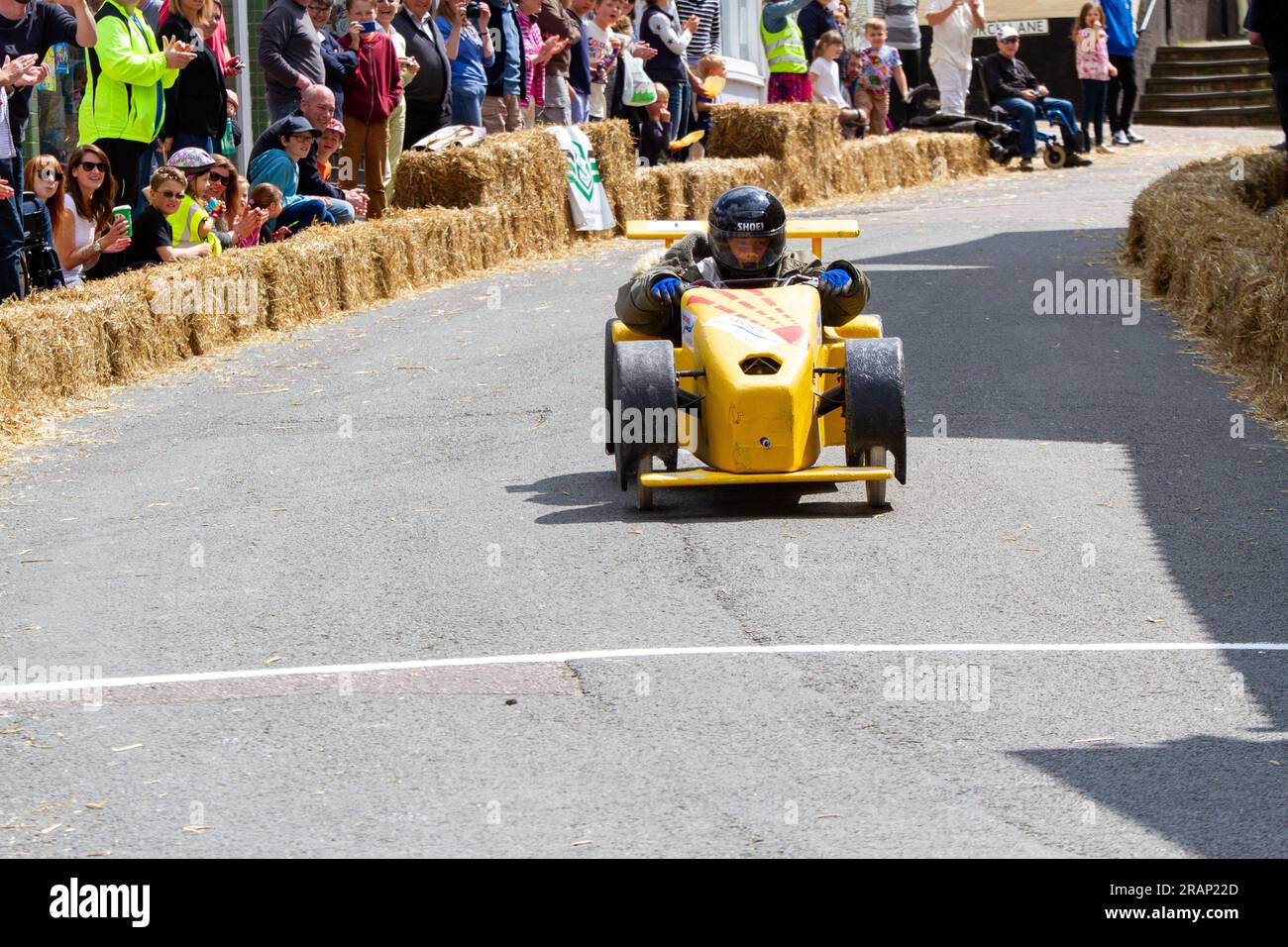 Yellow soapbox at the race finish line in Suffolk market town ...