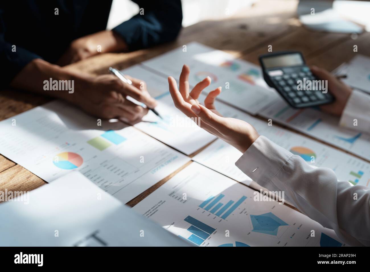 Accountant checking financial statement or counting by calculator ...