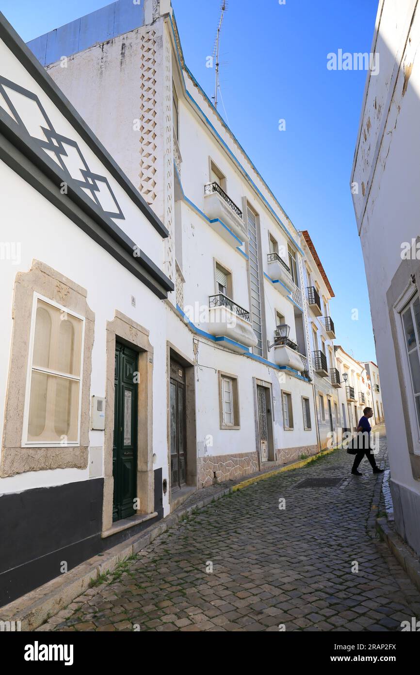 Tavira, Portugal- October 20, 2022: Narrow cobblestone street and ...