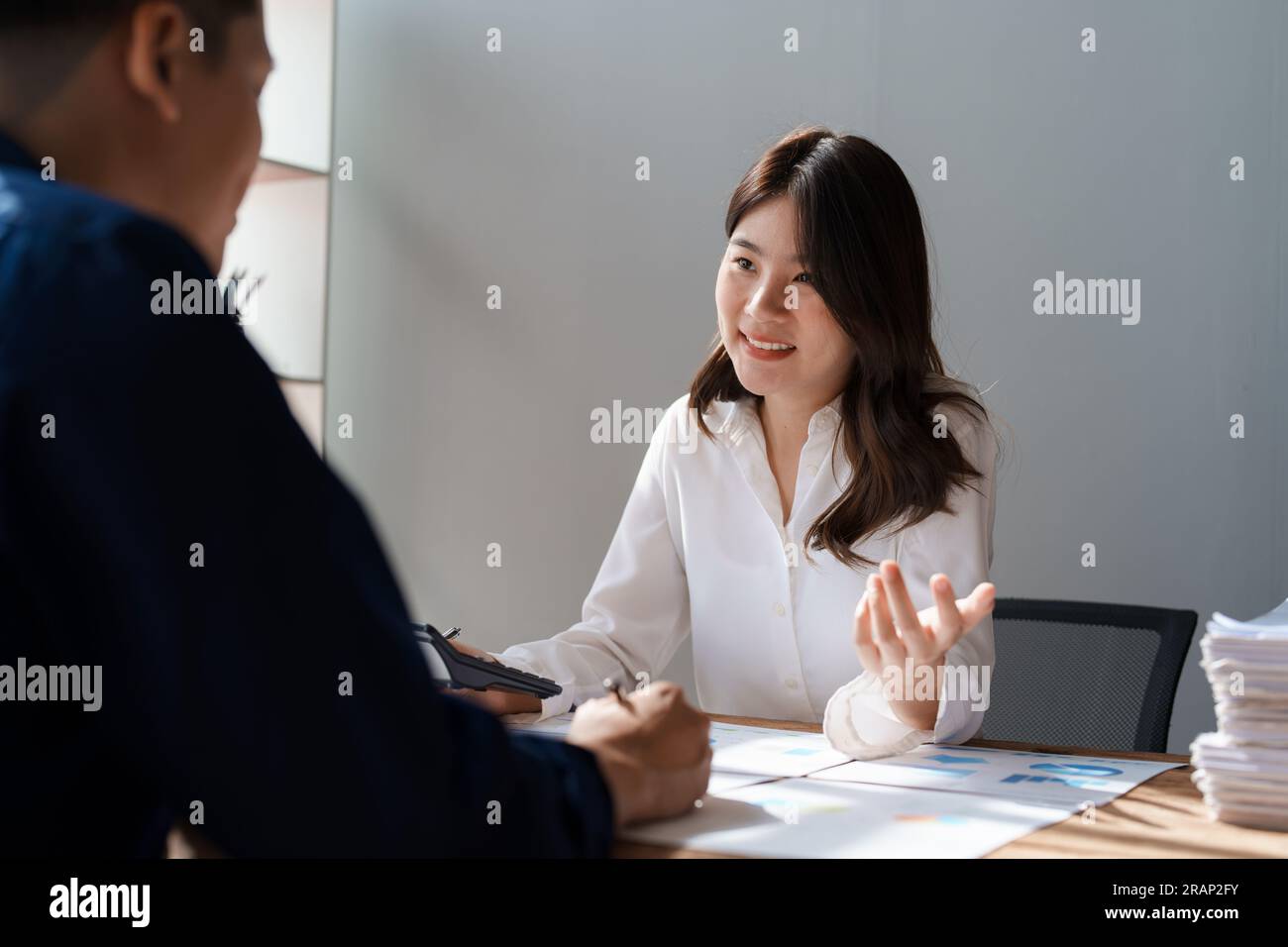 Accountant checking financial statement or counting by calculator ...