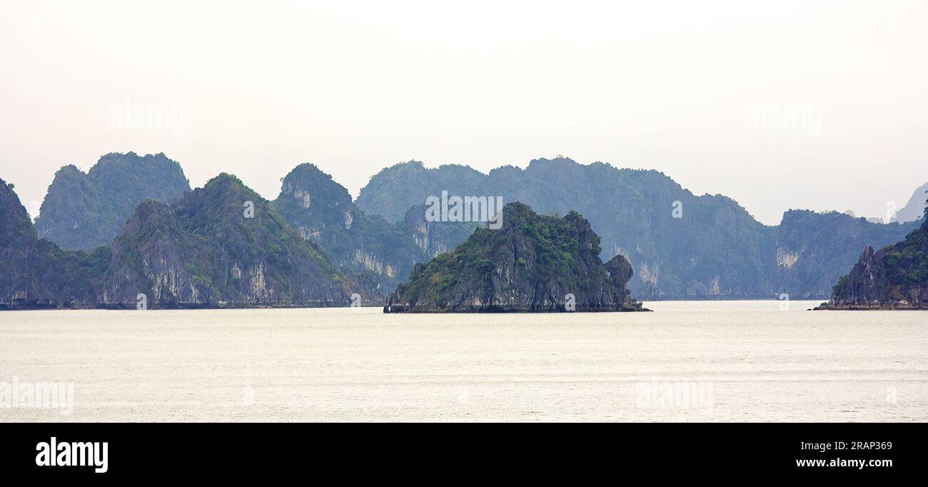 Ha Long Bay in misty weather Stock Photo - Alamy