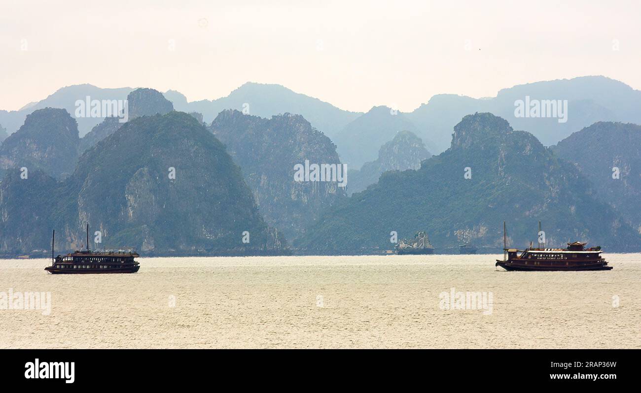Ha Long Bay in misty weather Stock Photo - Alamy