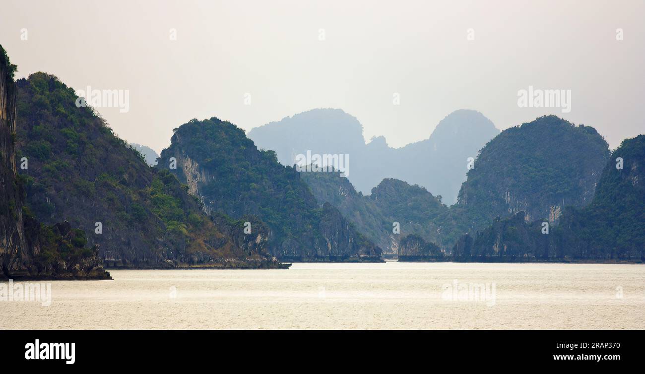Ha Long Bay in misty weather Stock Photo - Alamy