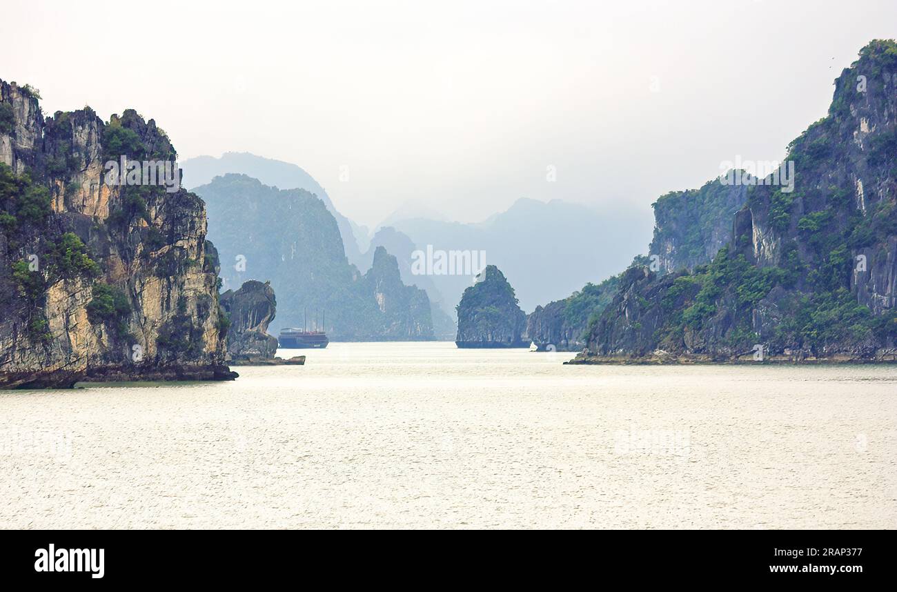 Ha Long Bay in misty weather Stock Photo - Alamy