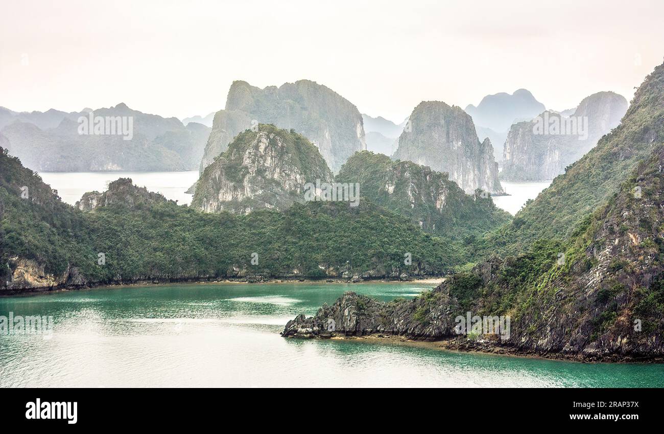 Ha Long Bay in misty weather Stock Photo - Alamy