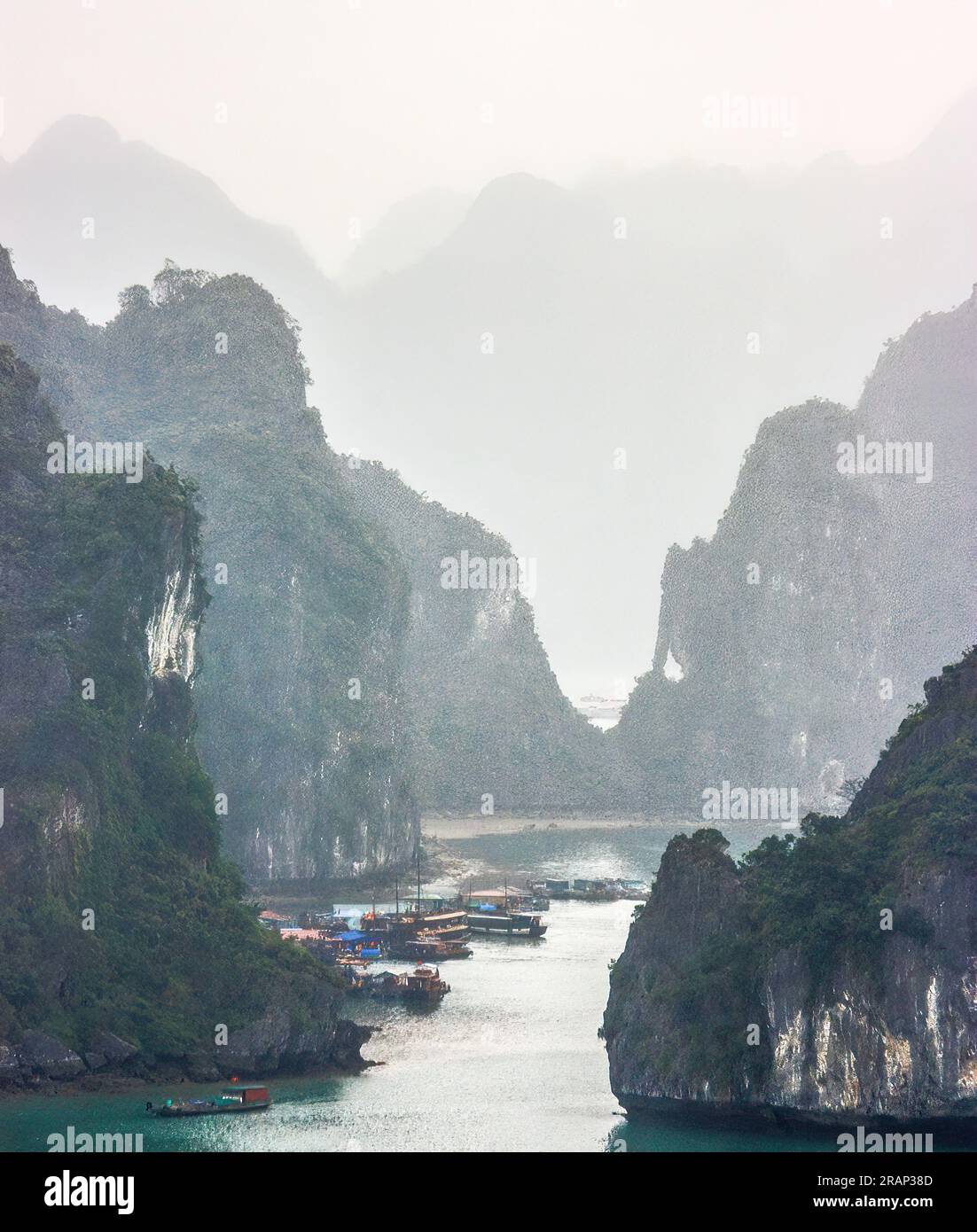 Ha Long Bay in misty weather Stock Photo - Alamy