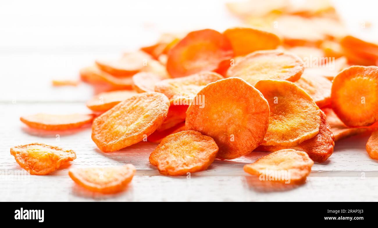 Dried vegetables chips from carrot. Organic diet and vegan food Stock ...