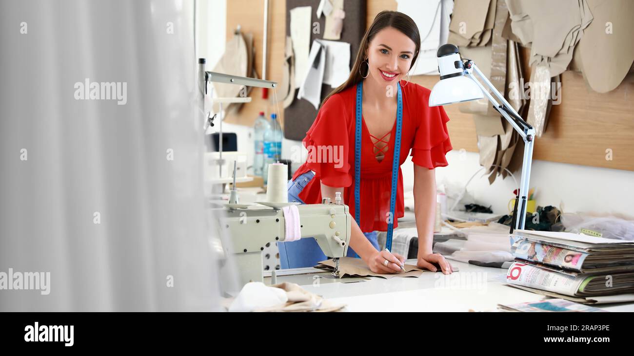 Female tailor working in modern atelier Stock Photo - Alamy