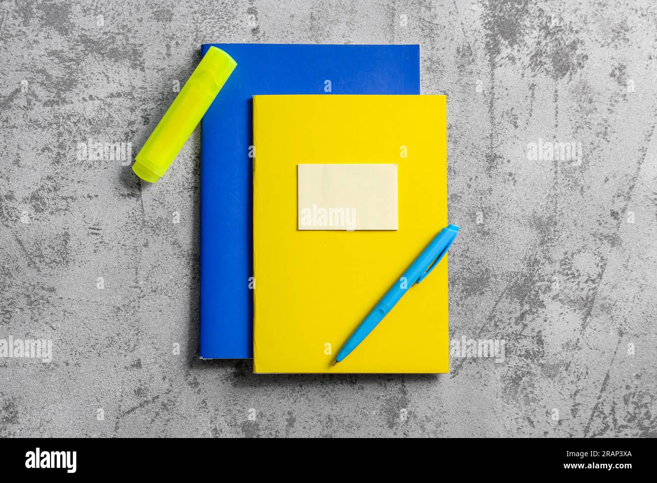 Notebooks, pen, sticky note and marker on grunge background Stock Photo ...