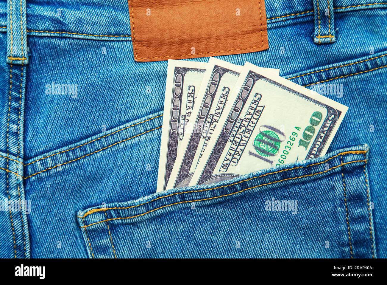 Money in the pocket of blue jeans. One hundred dollar bills Stock Photo ...