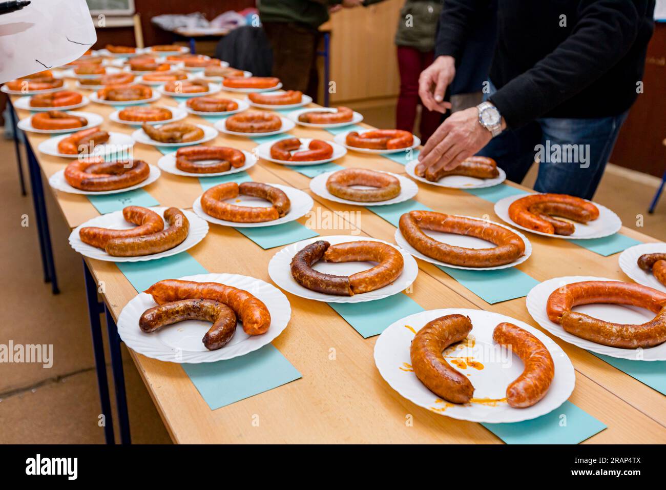 Traditional sausages are arranged for review at food contest. Judges ...