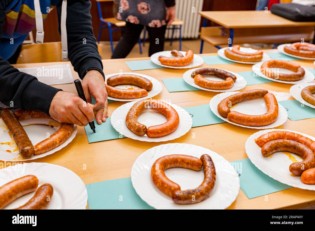 Traditional sausages are arranged for review at food contest. Judges ...