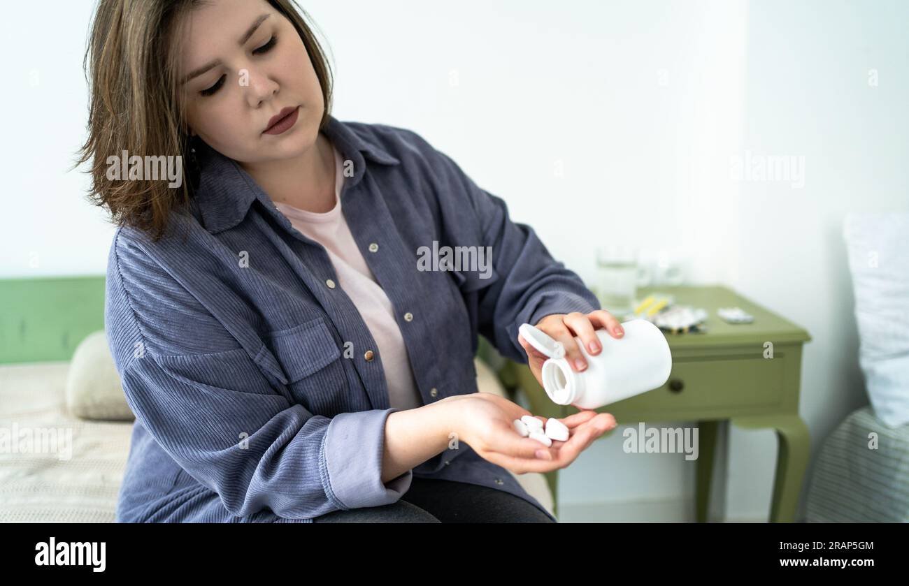 Plump plus-size girl with weight loss pills, drugs or dietary ...