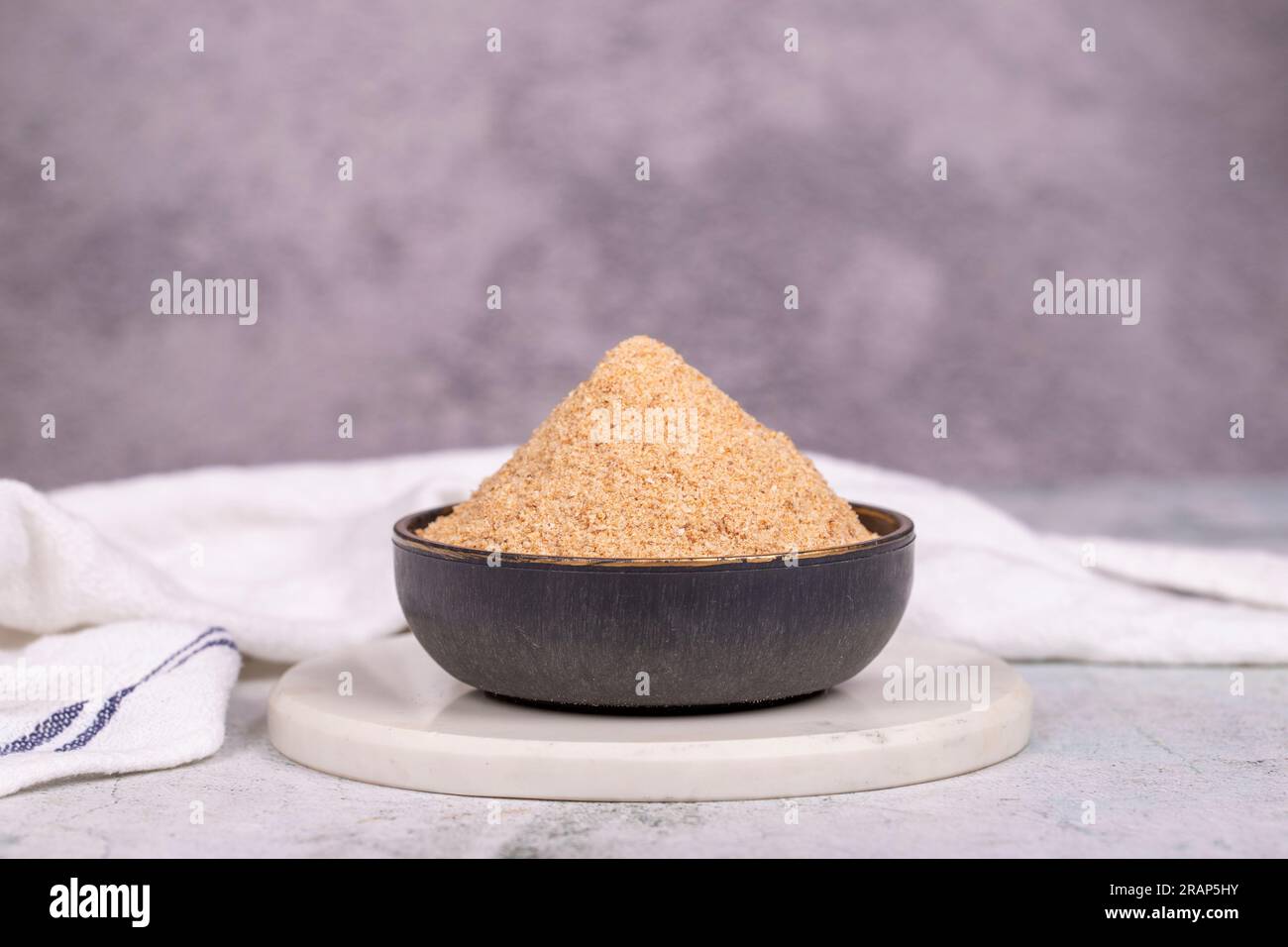 Breadcrumbs on grey background. Breadcrumbs flour in bowl Stock Photo ...