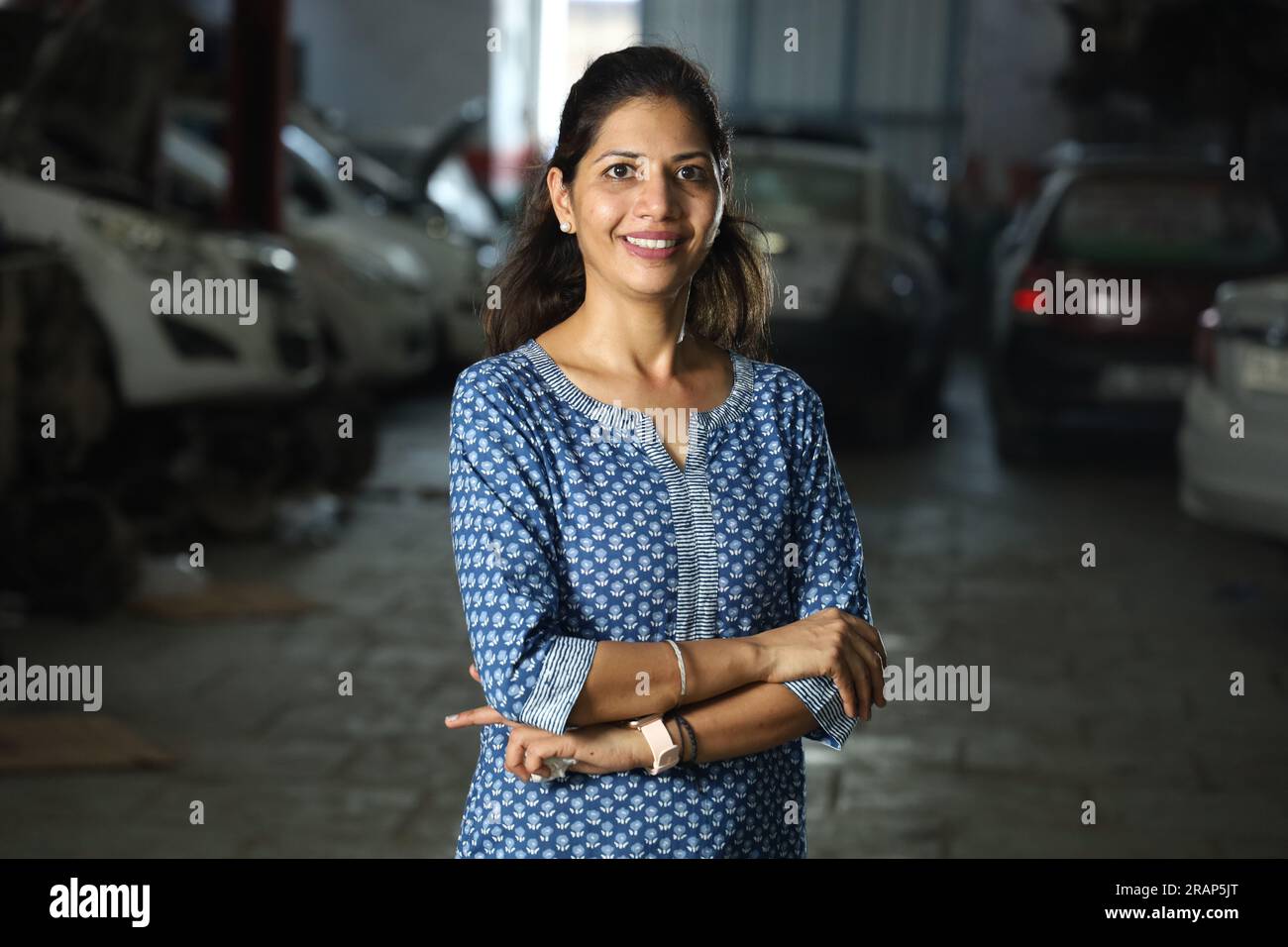 Indian happy female customer showing a thumbs up for repairing the car ...