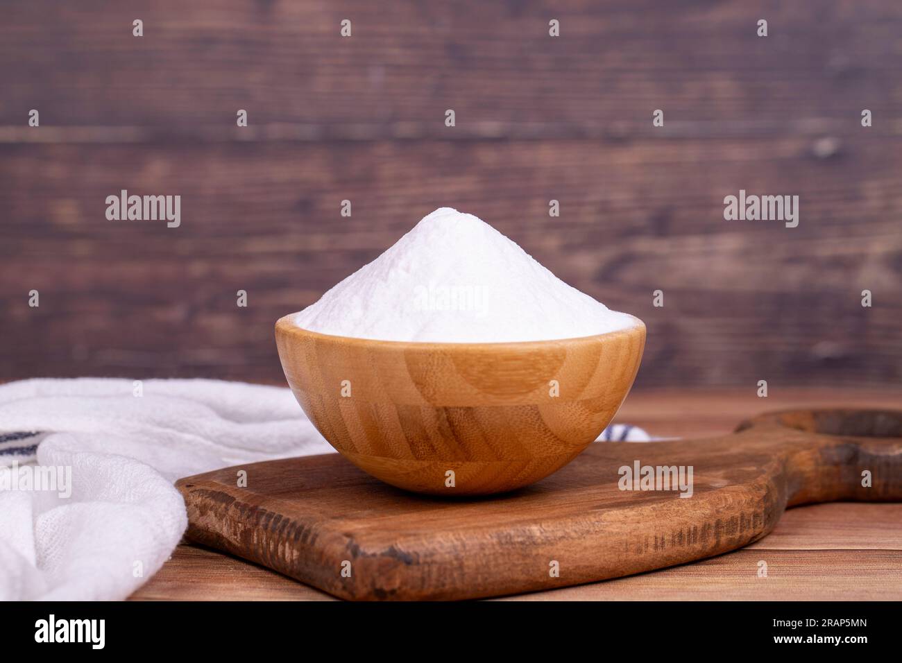Sodium bicarbonate or baking soda on wood background. Sodium ...