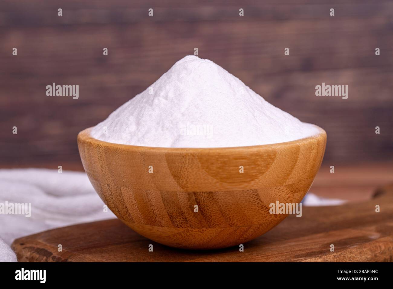 Sodium bicarbonate or baking soda on wood background. Sodium ...