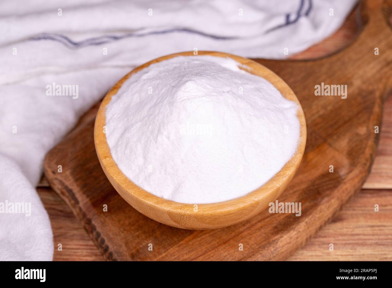 Sodium bicarbonate or baking soda on wood background. Sodium ...